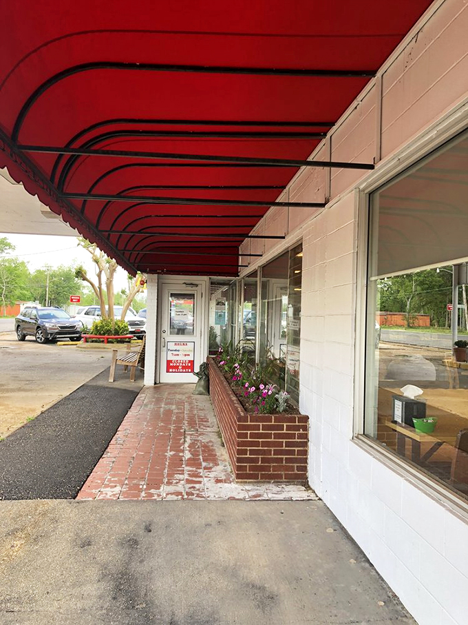 The welcoming entrance with its signature red awning and flower boxes &ndash; a portal to pie paradise that's been tempting travelers for generations.