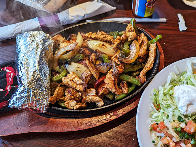 The sizzle plate isn't just serving fajitas; it's delivering an aromatic announcement that something wonderful is about to happen to your taste buds.