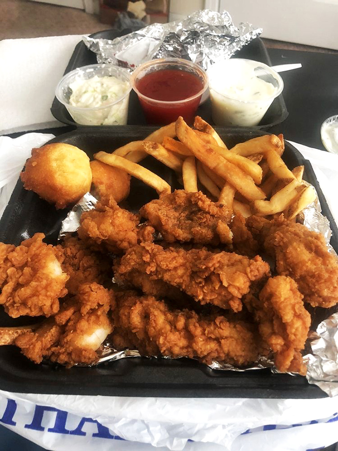 Not just fried fish&mdash;it's an edible gold rush with hushpuppies standing guard. The kind of meal that demands a moment of respectful silence.