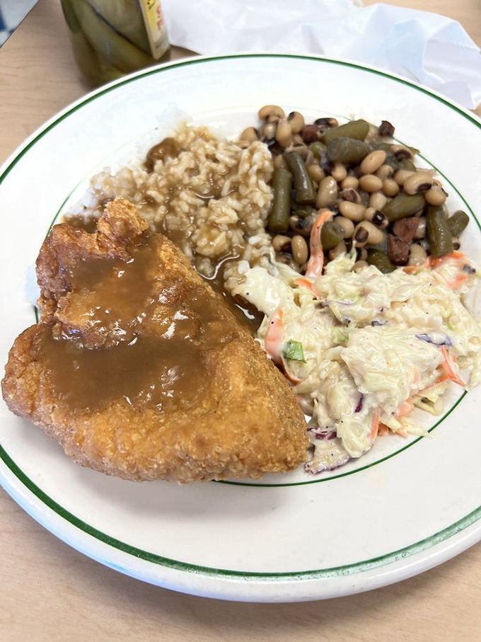 Fried chicken golden enough to make Colonel Sanders question his life choices, accompanied by sides that refuse to be mere afterthoughts.