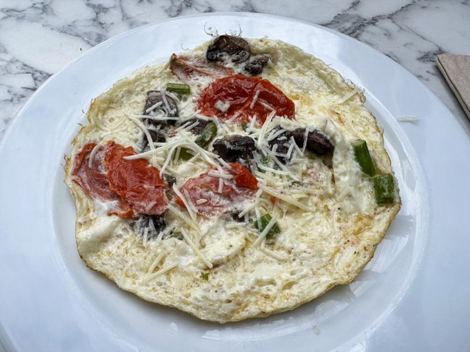 This frittata doesn't just contain ingredients; it showcases them like a delicious museum of breakfast possibilities.