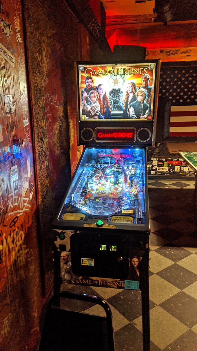 The Game of Thrones pinball machine stands like an iron throne among jesters, proving even in dive bars, winter is coming... right after one more round.