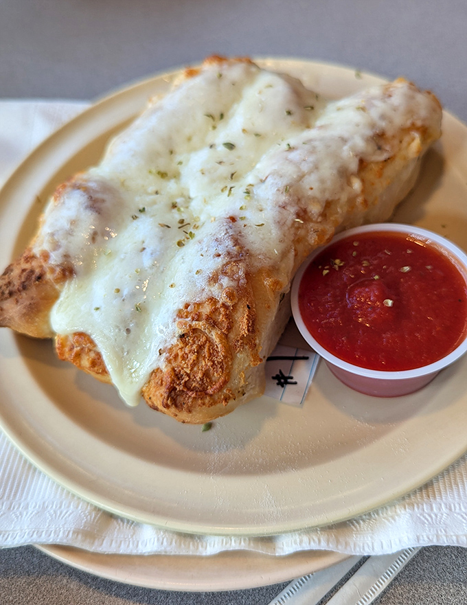 Garlic cheese bread that makes you temporarily forget about pizza. The stretchy cheese pull would make any food photographer weep with joy.