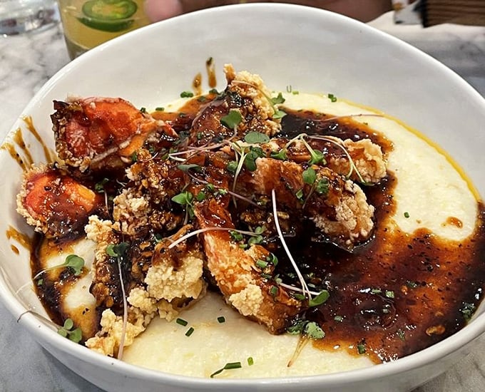 Another angle on their signature shrimp and grits &ndash; because food this photogenic deserves a portfolio. The sauce alone could make you weep with joy.