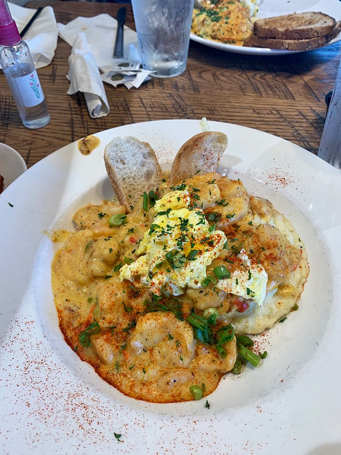 A masterclass in shrimp and grits presentation. Those green onions aren't just garnish&mdash;they're the exclamation point on a perfect culinary sentence.