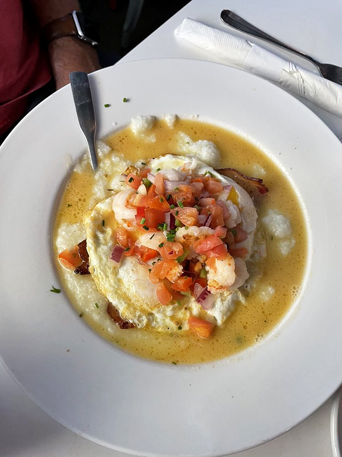 Each spoonful requires a moment of silence. That egg yolk breaking into the grits creates a sauce that should have its own VIP section on the Strip.