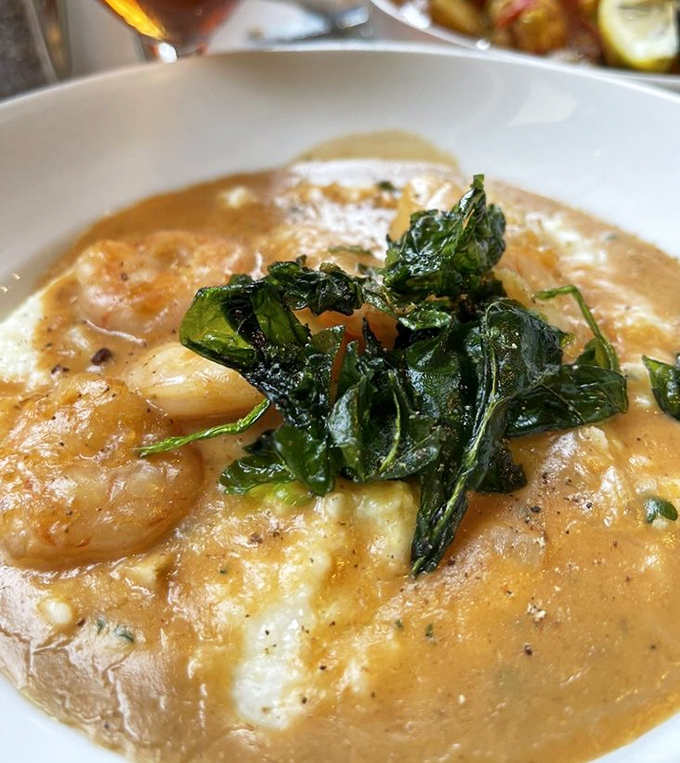 This isn't just shrimp and grits&mdash;it's a Lowcountry lullaby in a bowl, with crispy greens providing the perfect counterpoint to that silky sauce.