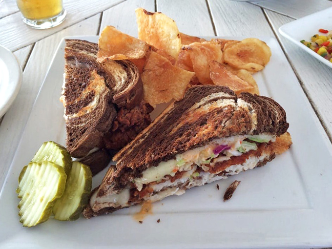 The elevated dining area extends the restaurant's reach toward the water, as if trying to close the final gap between Midwest and oceanside.