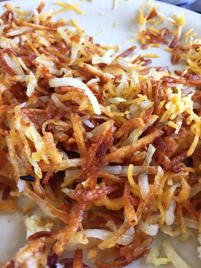 These aren't just hash browns&mdash;they're a crispy, golden masterpiece of potato engineering with cheese melted throughout. Breakfast architecture at its finest.