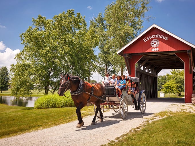 Horse-drawn carriage rides through covered bridges offer a glimpse into the past, minus the dysentery and lack of Wi-Fi that historically accompanied such journeys.