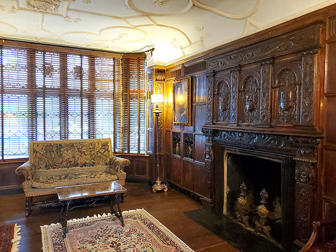 The sitting room's ornate fireplace mantel could be a museum piece itself&mdash;carved with the kind of details craftsmen would charge extra for today.