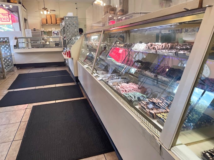 The pristine interior reveals a candy laboratory where sweet dreams are manufactured daily and chocolate fantasies become reality.