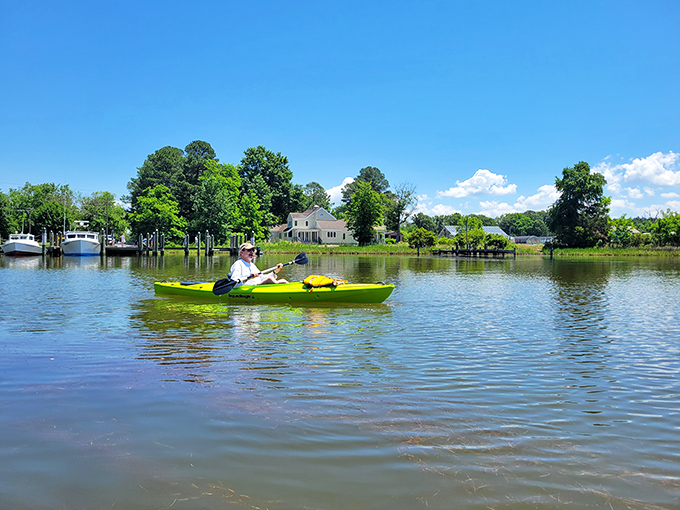 Exploring St. Michaels by kayak offers water-level views of shoreline homes and the peaceful rhythm of paddle meeting Chesapeake waters.
