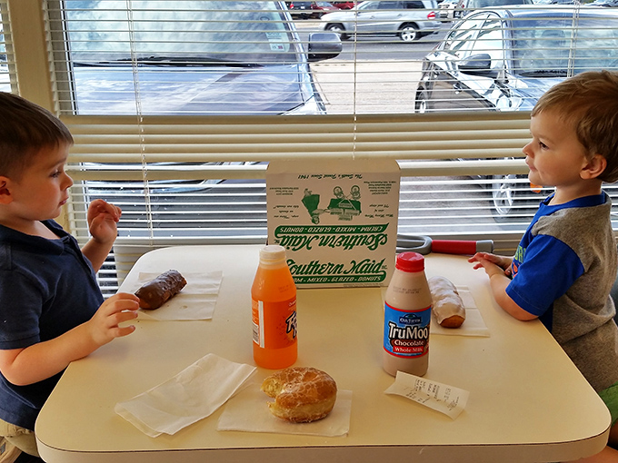 Young donut scholars getting an early education in the important cultural tradition of breakfast pastry appreciation.