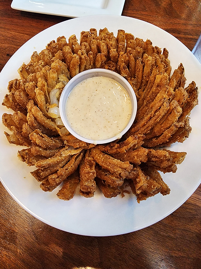 The Bloomin' Onion's sophisticated cousin &ndash; crispy, golden petals arranged like a sunburst around creamy dipping sauce. Worth every calorie.