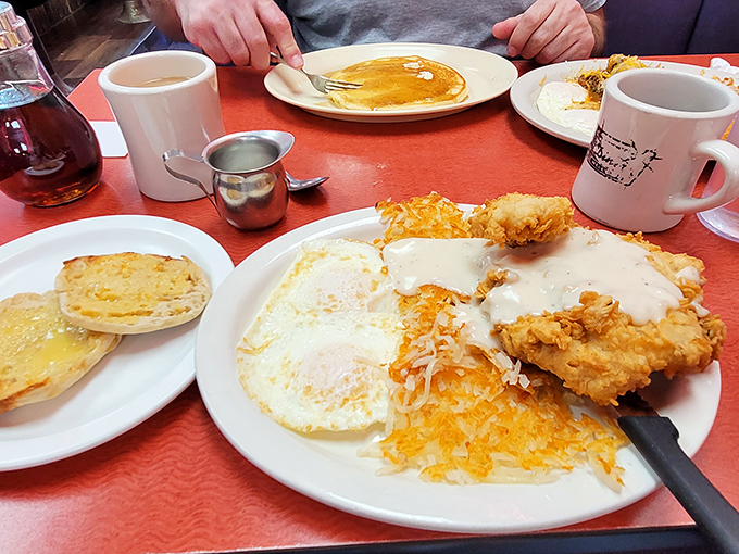 A table-wide festival of breakfast favorites, with those iconic Diner mugs standing like sentinels over the morning feast.