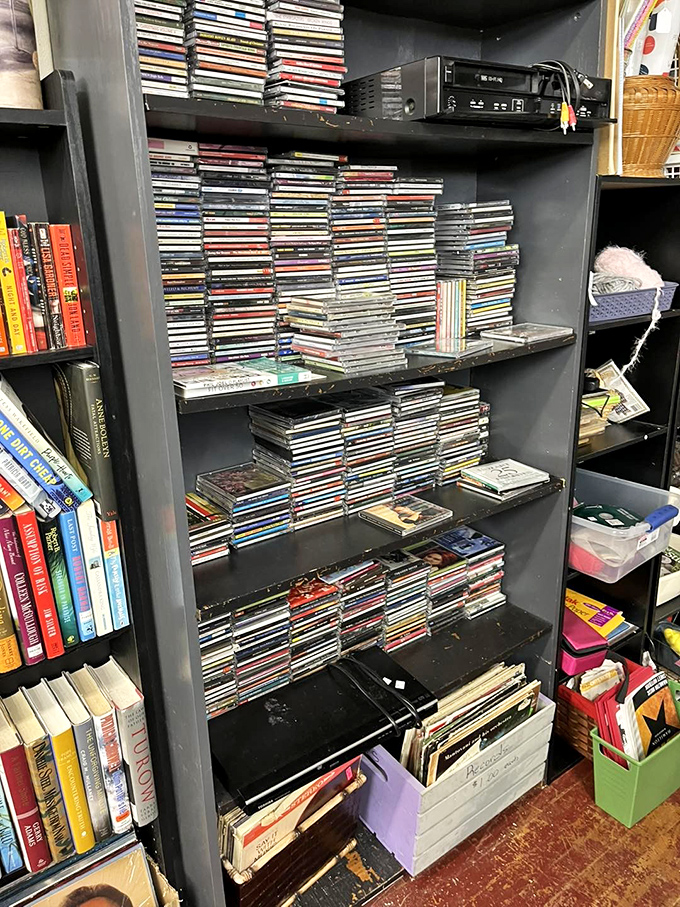 These stacks of CDs and cassettes aren't obsolete technology – they're musical time capsules waiting for the right nostalgic soul.