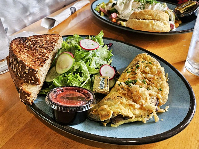 This isn't just an omelette&mdash;it's a perfectly executed morning masterpiece with a supporting cast of fresh greens and hearty toast ready for their close-up.