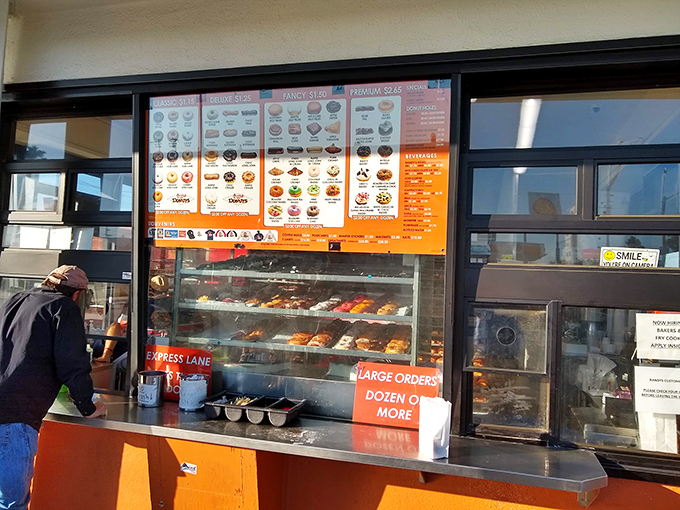 The ordering window &ndash; where strangers become united in their quest for fried dough perfection. Democracy in action, really.
