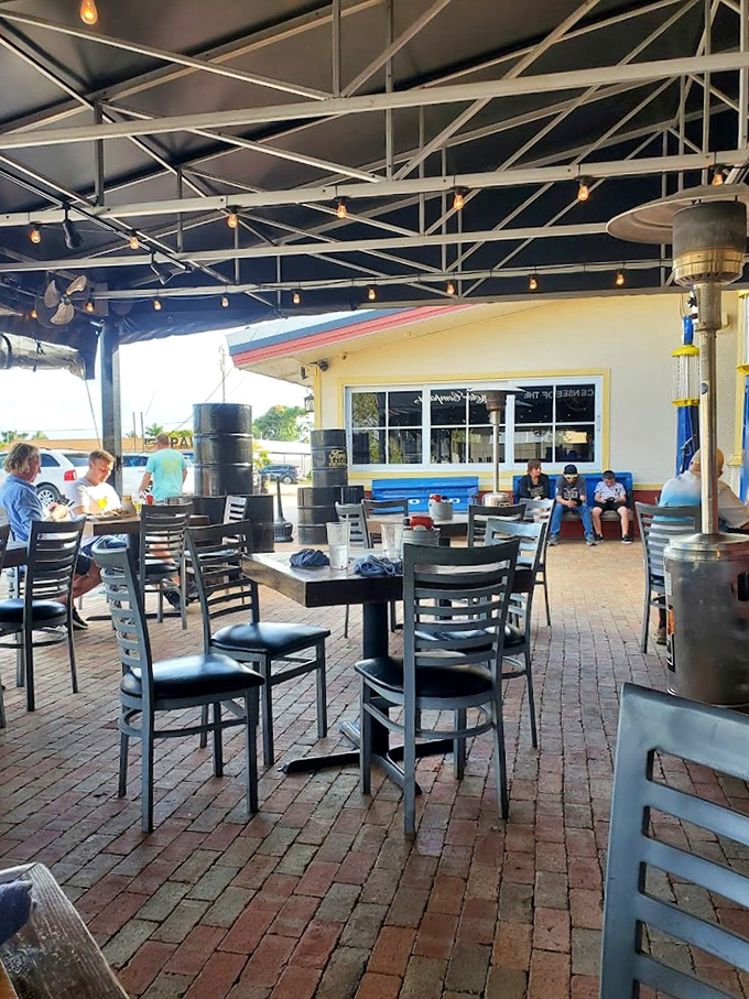 The outdoor patio provides a shaded sanctuary for enjoying burgers and brews. Those oil drum decorations aren't just for show&mdash;they're conversation starters with appetizers.