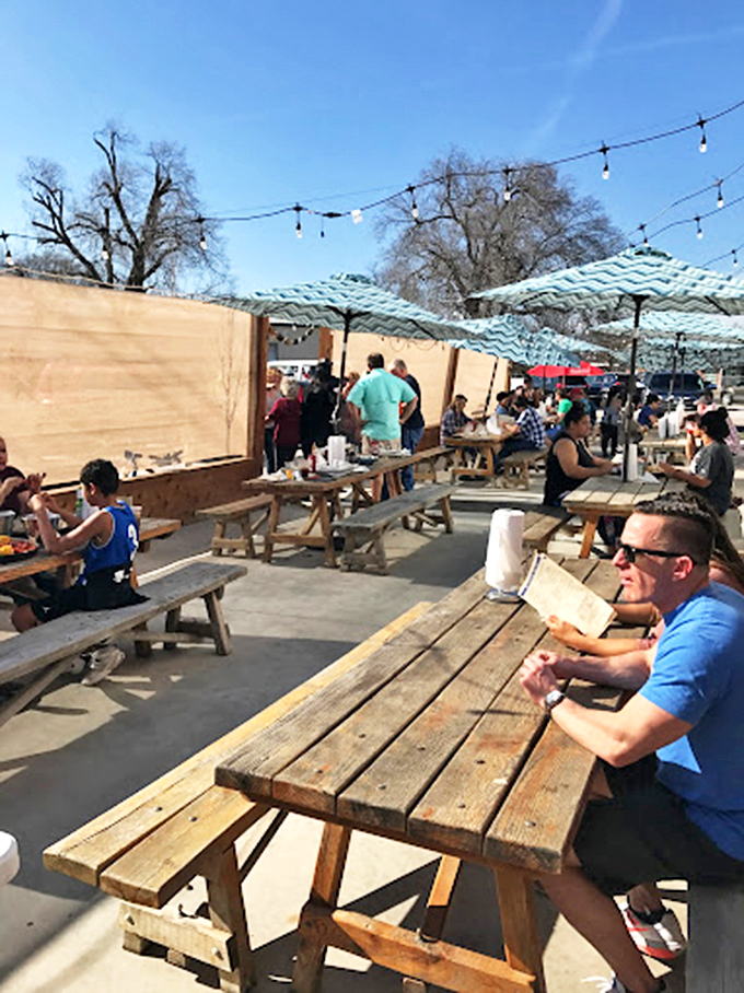 Sun-dappled picnic tables offer al fresco dining with a side of Arkansas sky. These wooden perches provide the perfect stage for seafood feasts when the weather cooperates.