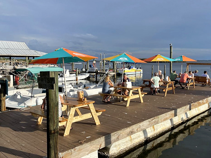 The dock dining area &ndash; where pelicans might judge your food choices while boats drift by in the background.