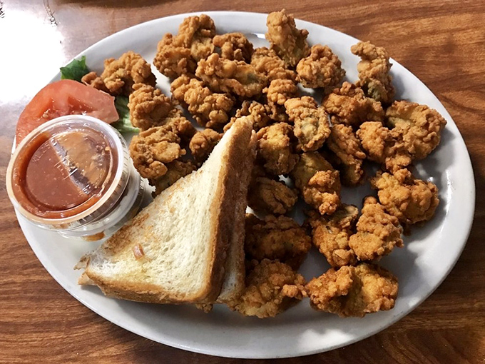 Another angle on those magnificent fried oysters&mdash;crispy, golden, and abundant. The toast is just there for moral support.