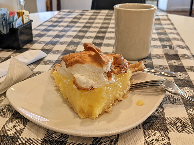 A slice of lemon meringue that should be in the Smithsonian's "Perfect American Desserts" exhibit. That meringue has serious architecture skills.