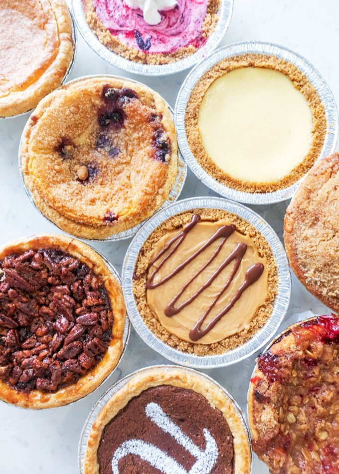 A constellation of mini pies, each one a different universe of flavor. The hardest part isn't choosing&mdash;it's not choosing them all.