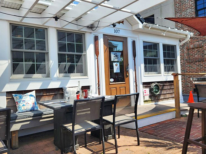 Outdoor seating that whispers "stay awhile" even on the busiest days. This porch doesn't just offer tables&mdash;it offers temporary ownership of Lewes.
