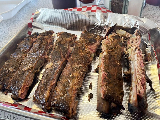 Ribs arranged like the world's most delicious xylophone. Each bone represents hours of patient smoking and generations of technique.