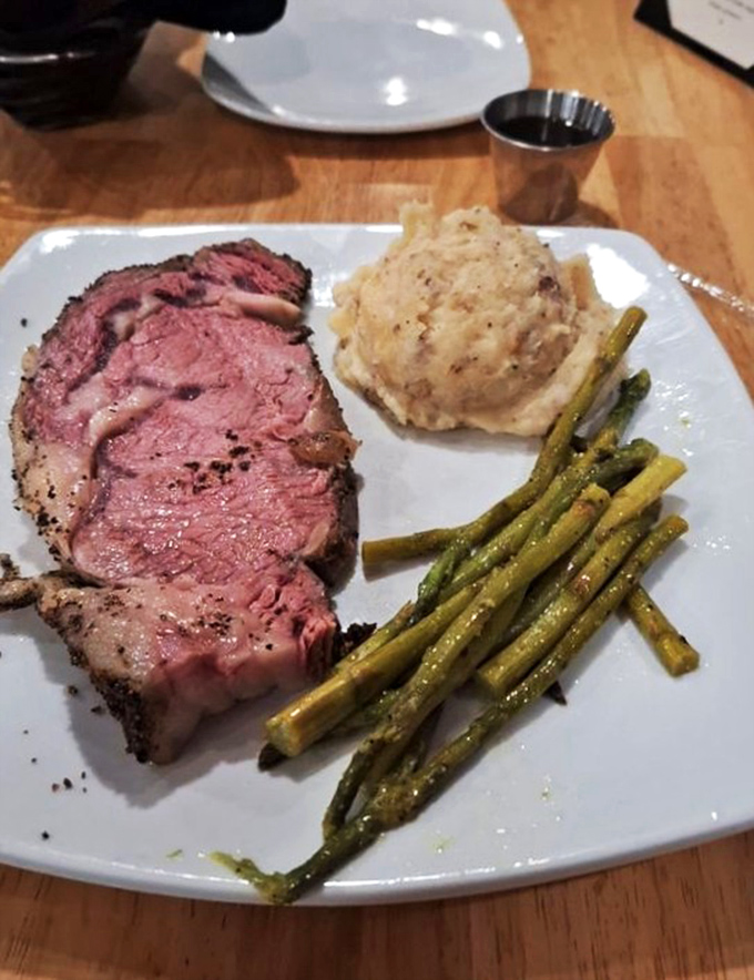 A medium-rare prime rib that practically melts on the plate, accompanied by mashed potatoes and asparagus&mdash;comfort food elevated to art form.