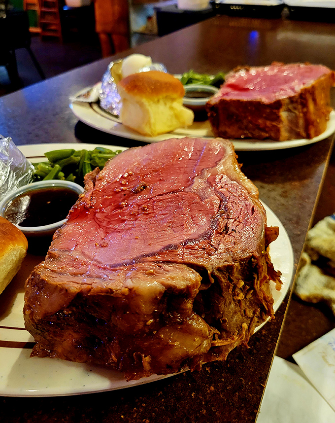 Prime rib so perfectly pink it makes rose gardens jealous. This isn't just dinner; it's a celebration carved from bovine perfection.