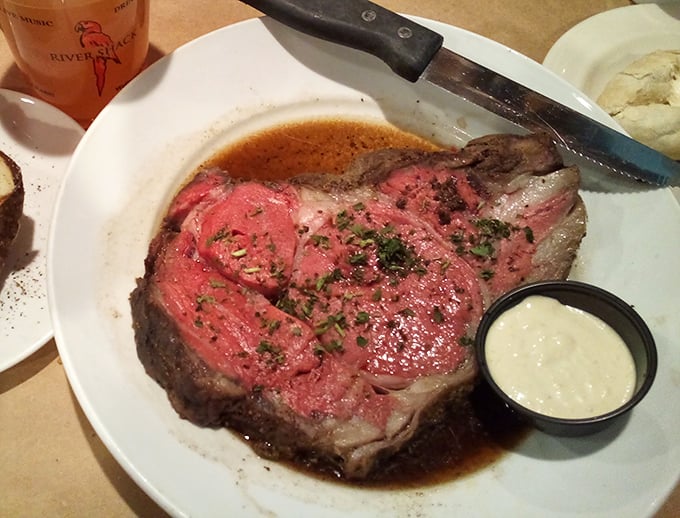 This prime rib, blushing pink and swimming in its own juices, makes a compelling argument that perfection doesn't require complexity, just respect for the ingredients.