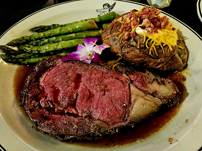 The pinnacle of carnivorous pleasure&mdash;prime rib beside a loaded baked potato with asparagus standing at attention. Dinner doesn't get more magnificent.