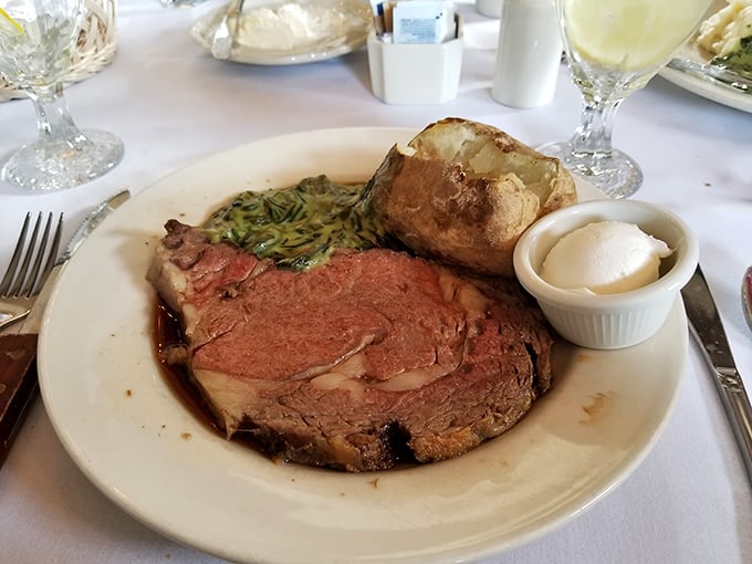 Prime rib cooked so perfectly it makes you wonder if the chef has some sort of meat telepathy. The baked potato stands by, ready for its close-up.