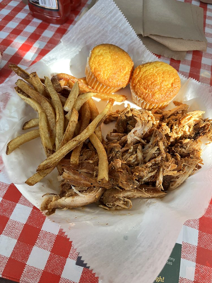 Pulled chicken that proves poultry deserves respect in the barbecue world. Those cornbread muffins and fries aren't just along for the ride.