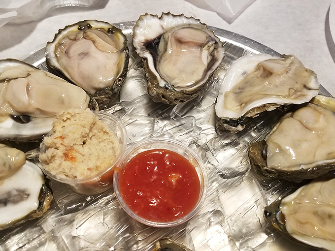 These oysters are social distancing around cocktail sauce, showing off their plump perfection while waiting for their lemon shower.