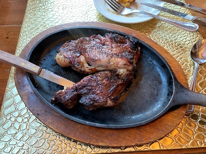 This cast iron skillet presentation isn't just dinner&mdash;it's dinner and a show, with a ribeye playing the starring role.