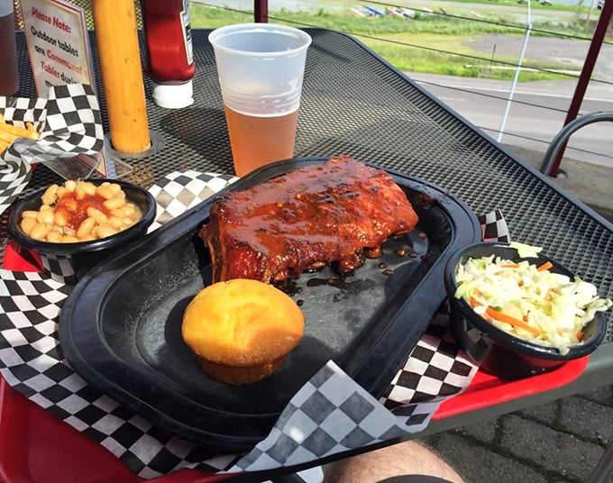This isn't just a rib platter &ndash; it's a testament to patience. Baked beans and coleslaw provide the perfect supporting cast.