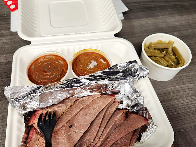 The kind of takeout that makes your car smell so good you'll consider living in it. Brisket, beans, and no regrets.