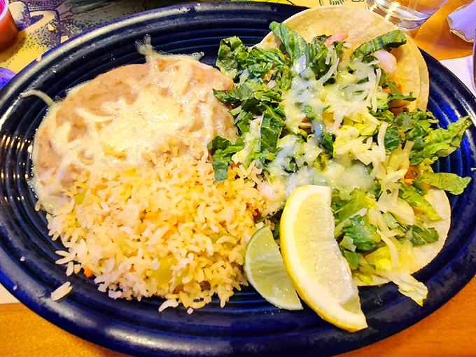 These fish tacos with perfectly yellowed rice aren't just lunch&mdash;they're a vacation on a plate. The lime wedges stand ready for duty.