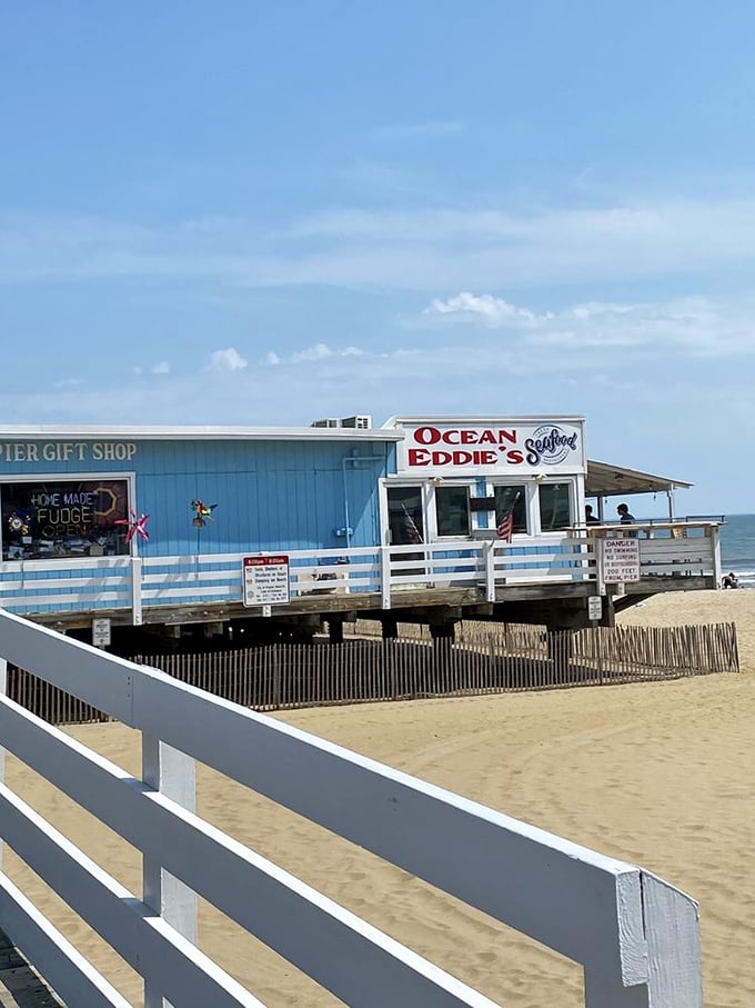 Ocean Eddie's sign stands as a beacon against the blue sky, promising seafood salvation to beach-goers with rumbling stomachs.