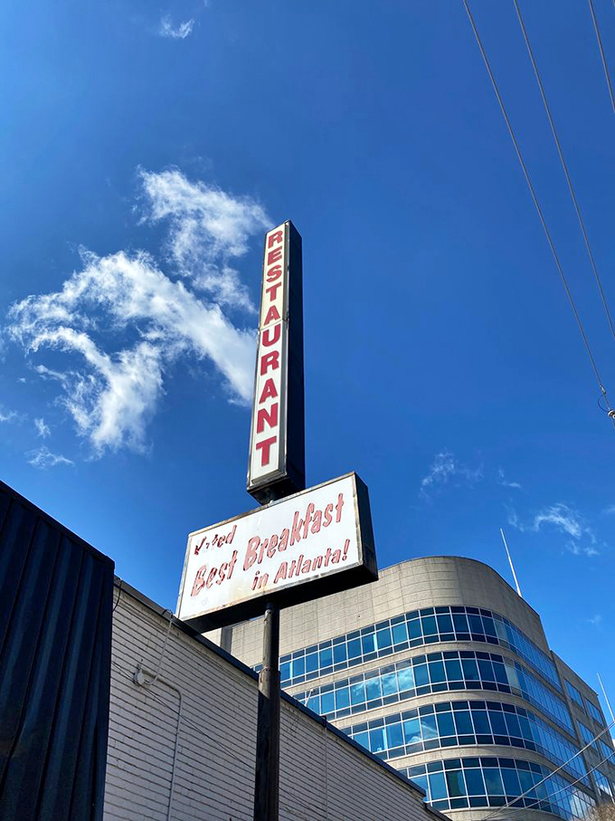 The vintage sign proudly proclaiming "Best Breakfast in Atlanta" against a blue sky&mdash;a bold claim backed by decades of consistent excellence.