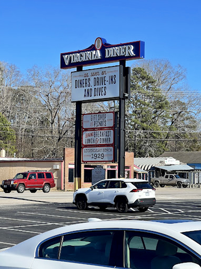 The roadside sign stands tall, a landmark for hungry travelers. When you see this, your stomach knows relief is just moments away.