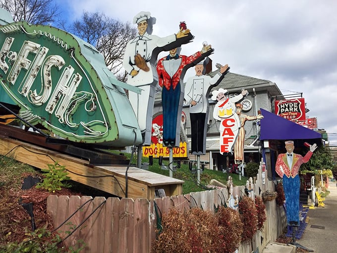 Not just a sign&mdash;a promise. The vintage "FISH" marquee and collection of service figures stand as quirky guardians of culinary treasures within.