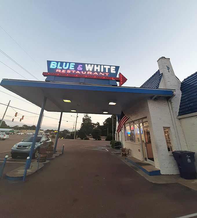 At dusk, that neon sign glows like a Southern firefly. Not all who wander are lost&mdash;some are just looking for the Blue & White.