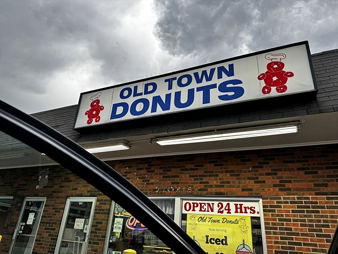 Storm clouds gather, but inside Old Town Donuts, it's always sunny. That 24-hour sign is a beacon of hope.