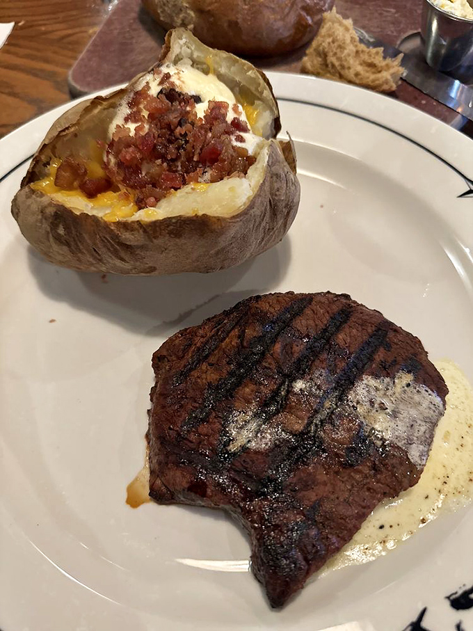 This steak and loaded potato aren't just a meal &ndash; they're a commitment to excellence that makes vegetarians question their life choices.