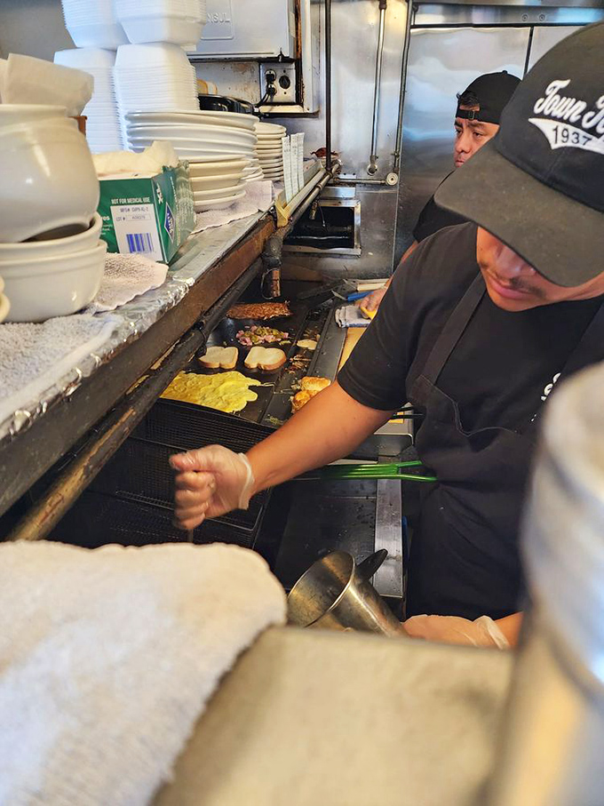 The ballet of short-order cooking&mdash;practiced hands creating masterpieces on a well-seasoned grill that holds decades of flavor memories.